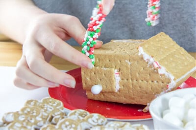 How to Make a Graham Cracker Gingerbread House • Kids Activities Blog