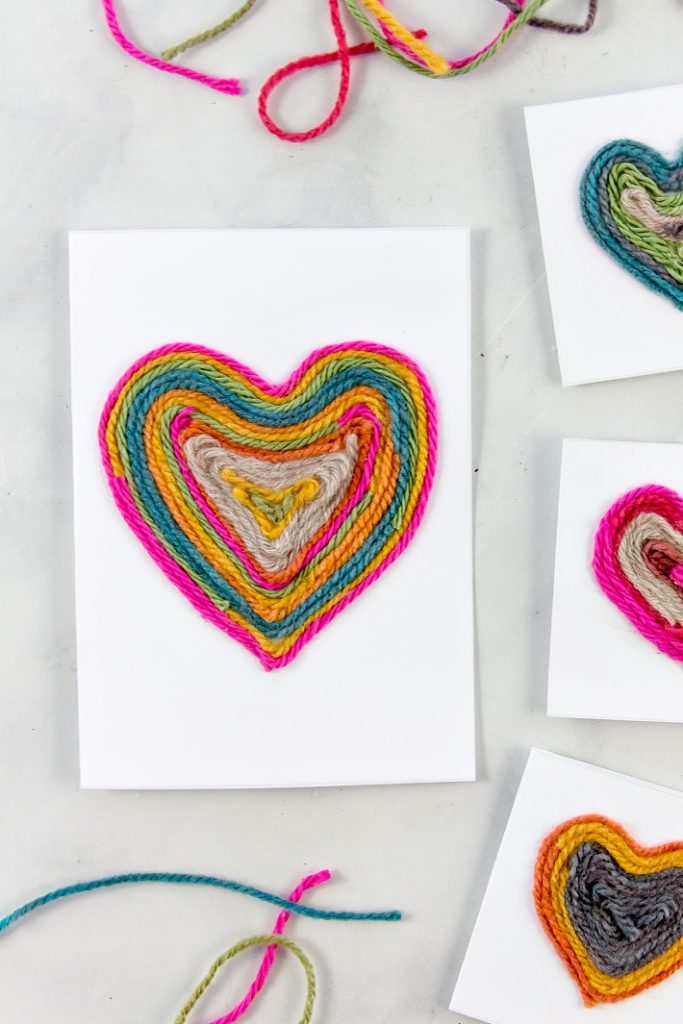 Make These DIY Valentine's Day Yarn Heart Cards • Kids Activities